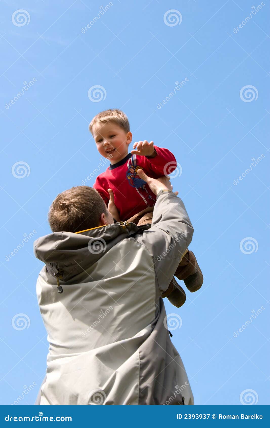 Father lifting his son stock image. Image of mature, shoulder - 2393937