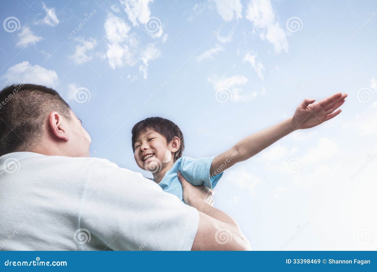 Father lifting son. stock image. Image of lifting, adult - 33398469