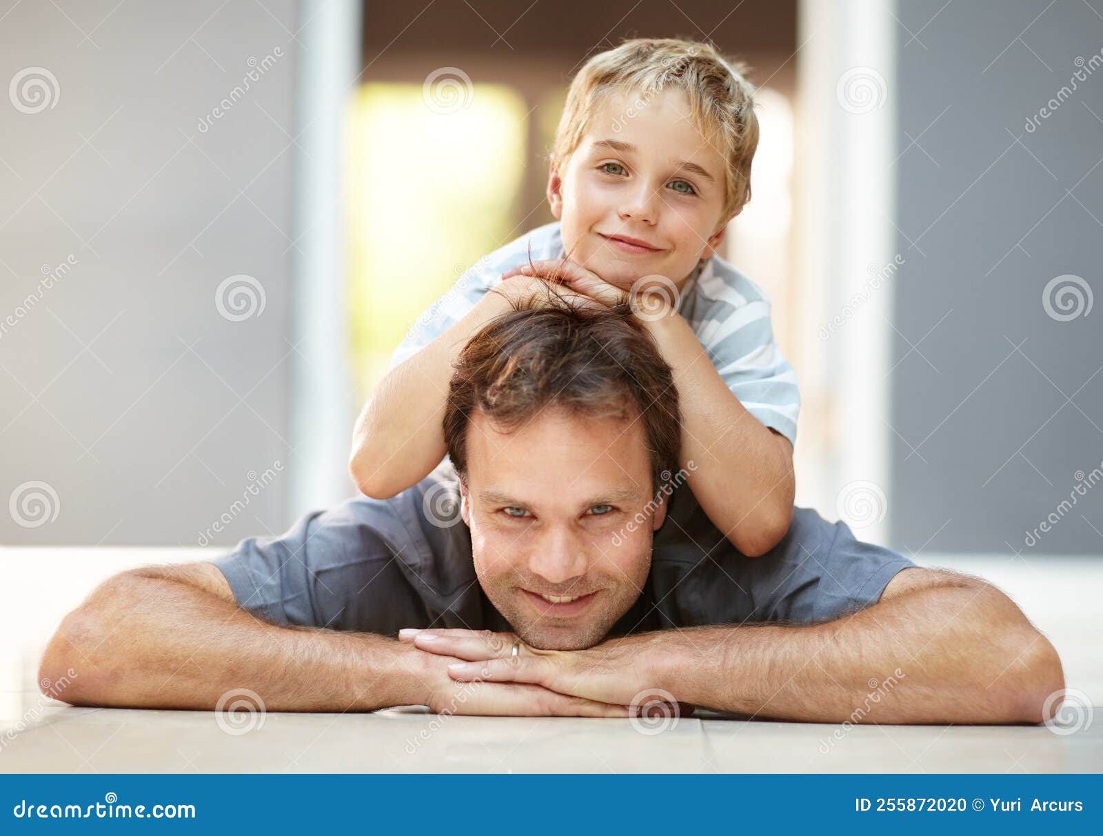 Father Like Son. Young Boy on Top of His Dad and Resting on His Head ...