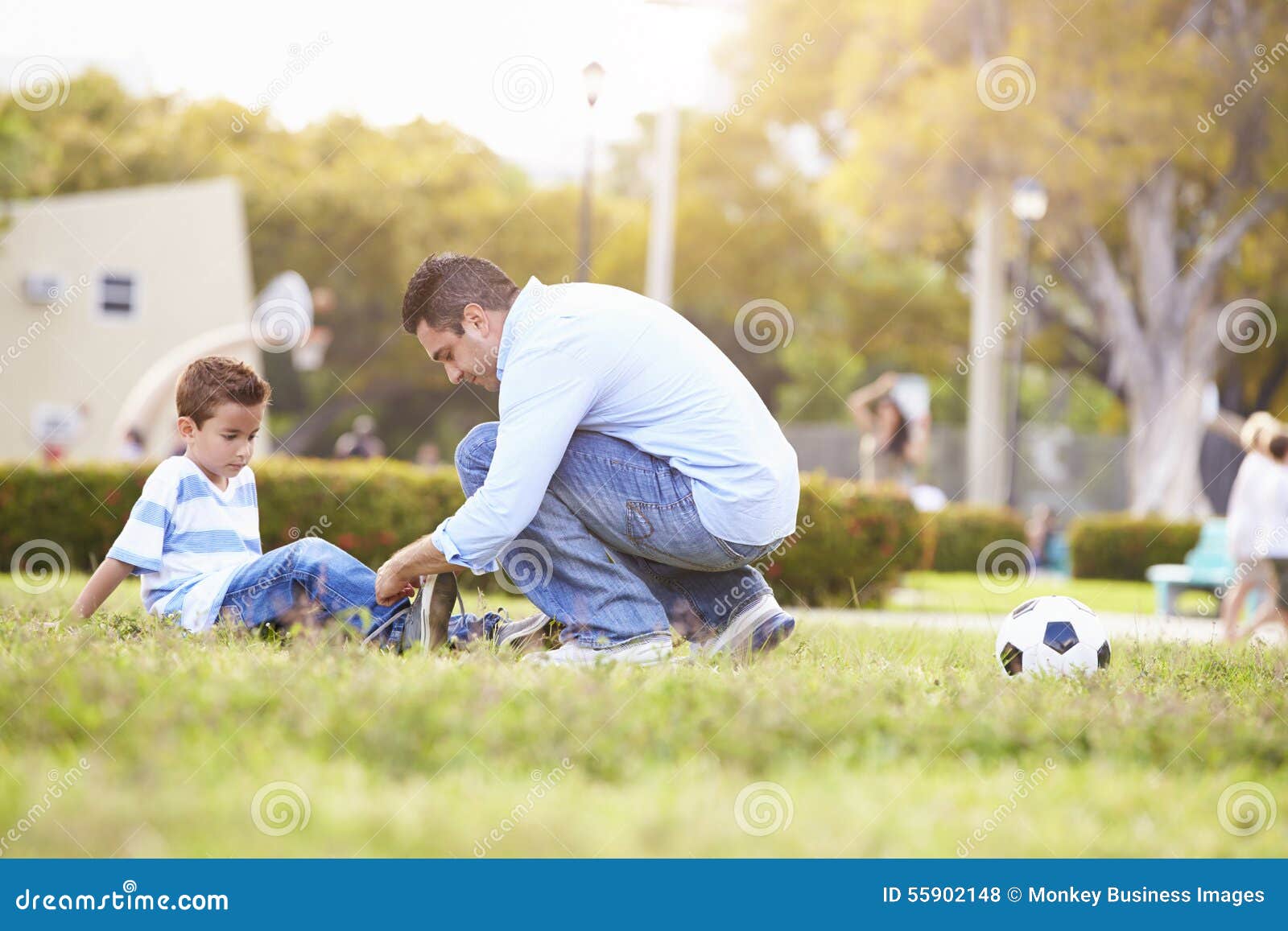 Father Looking after Son Injured Playing Football Stock Photo - Image ...