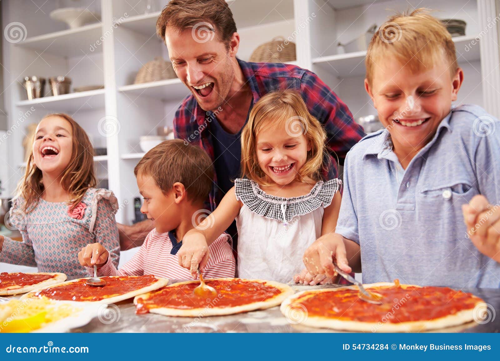 Father Making Pizza with His Kids Stock Photo - Image of daughter ...