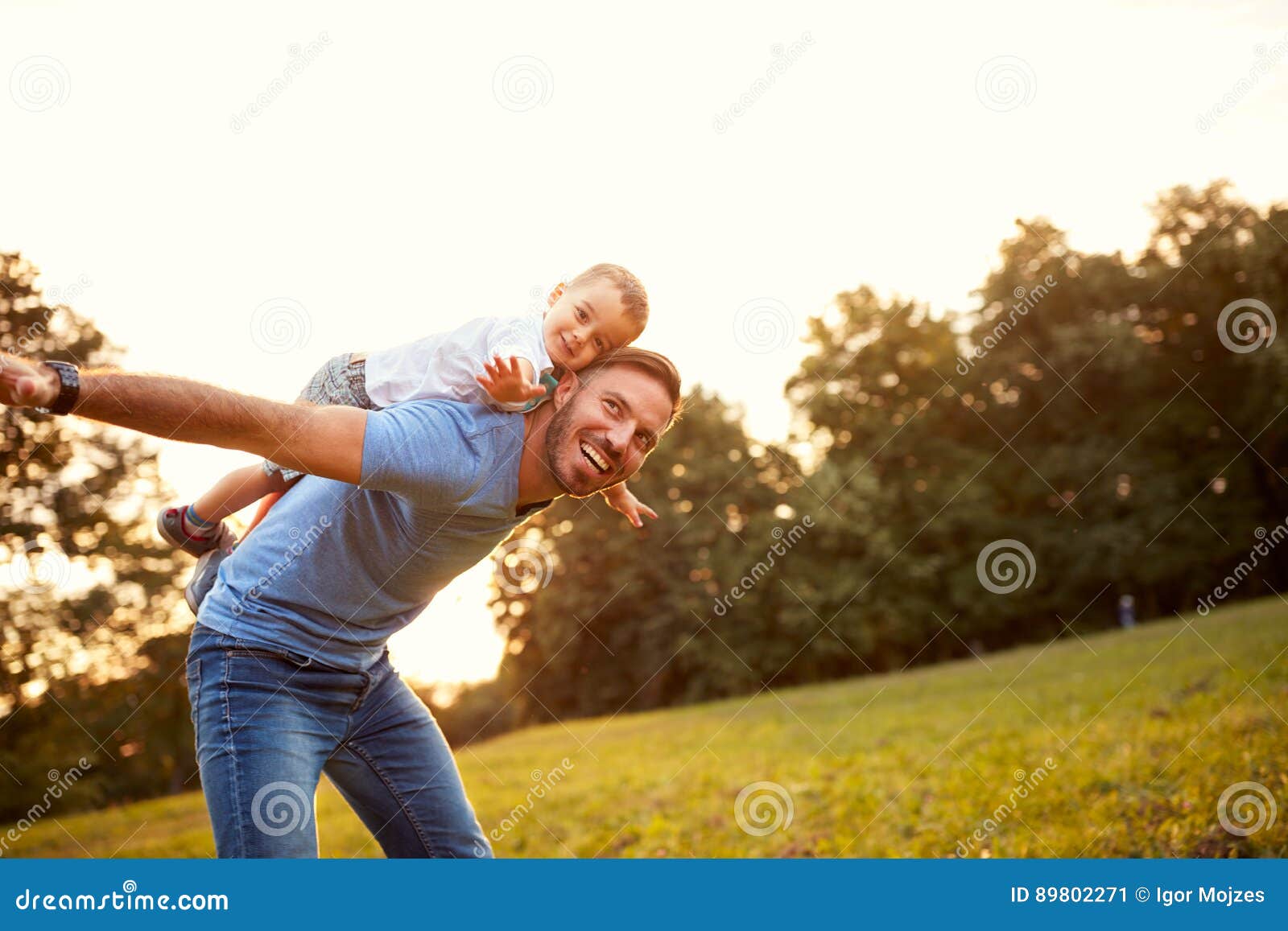 Father Piggyback Ride Supports And Motivates Son. Kids Education. Kid ...