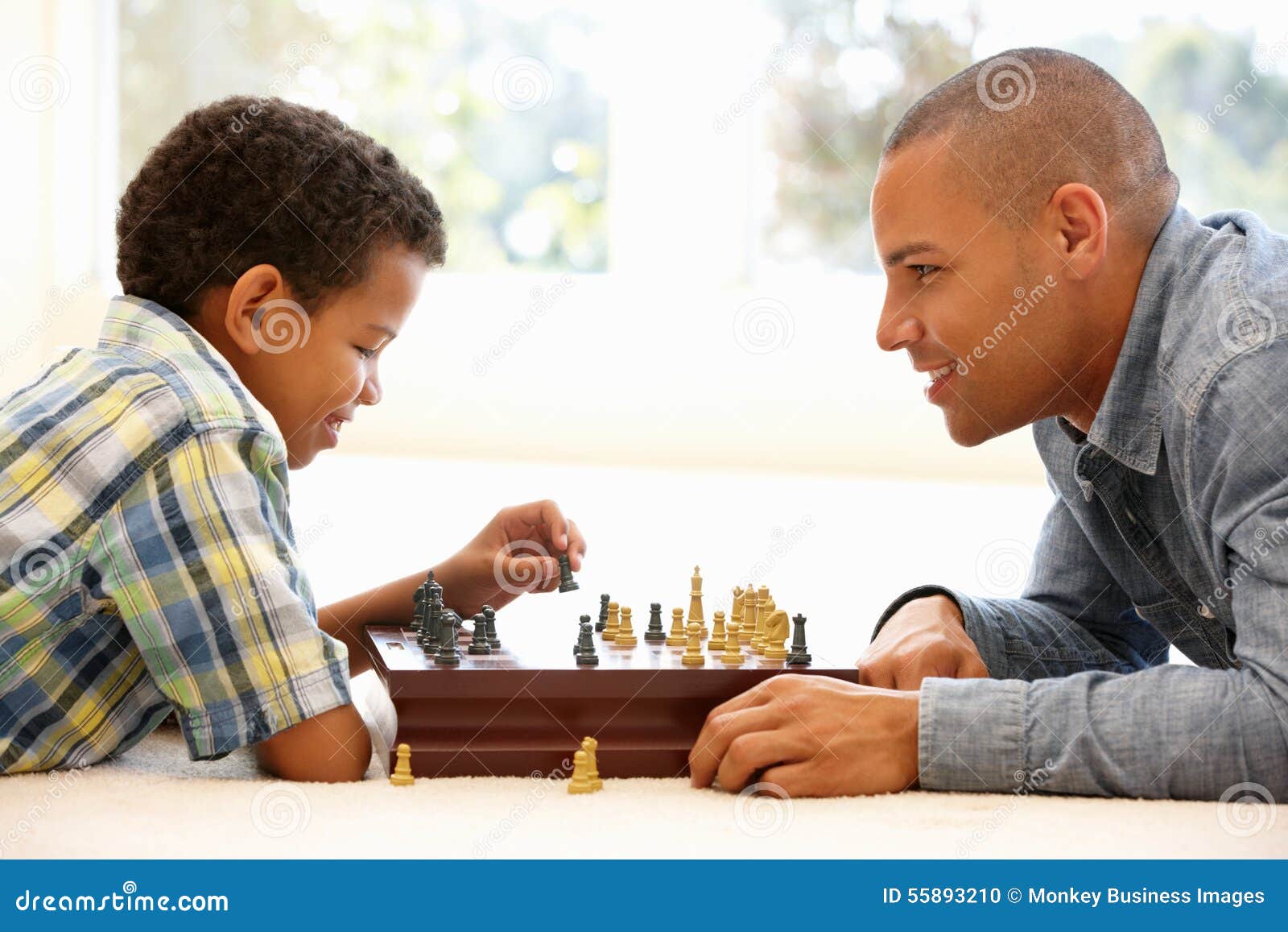 Father Playing Chess with Son Stock Photo - Image of inside, mixed ...