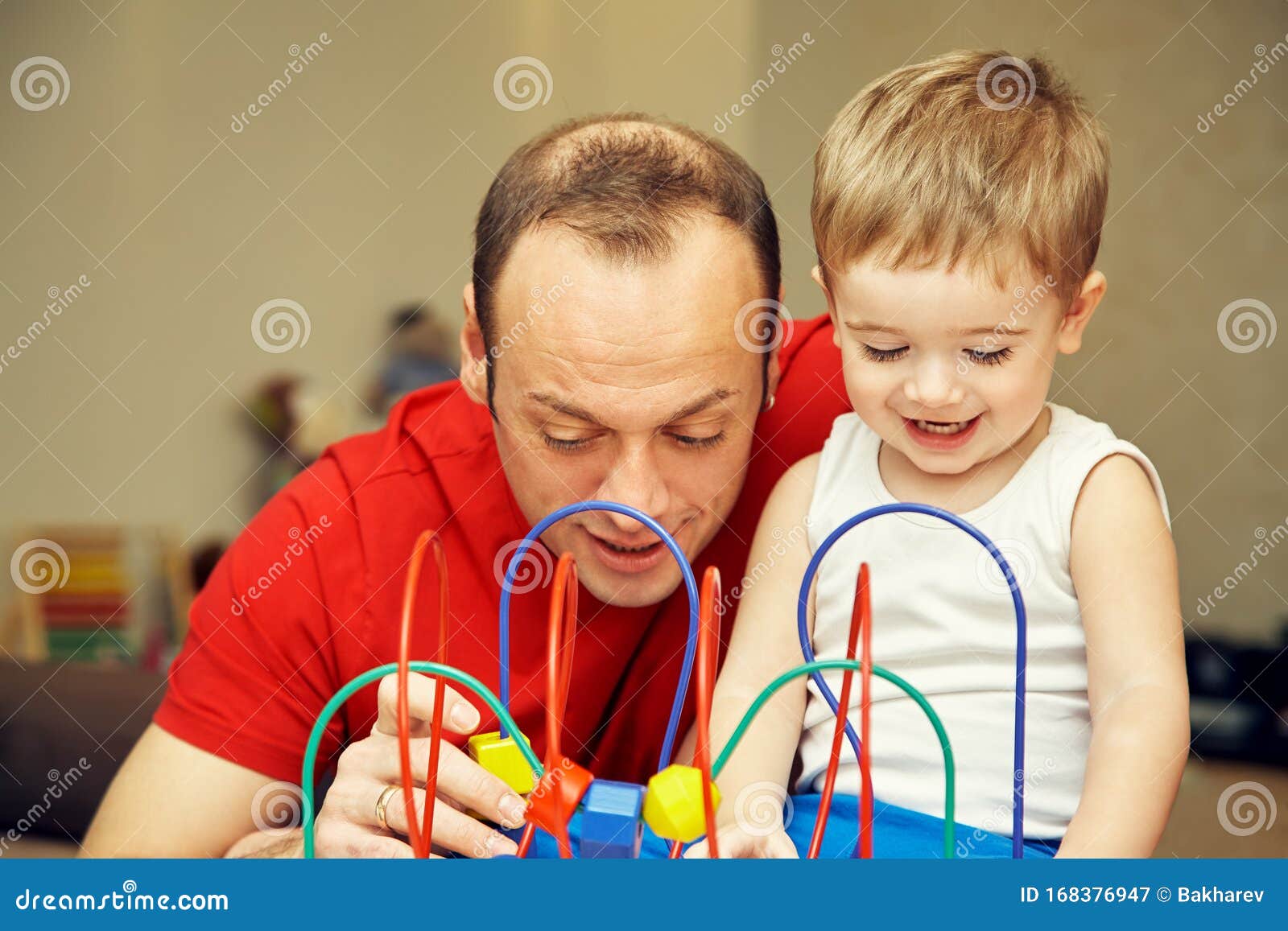 Father Playing with His Child in Developing Game at Home. Dad and Son ...