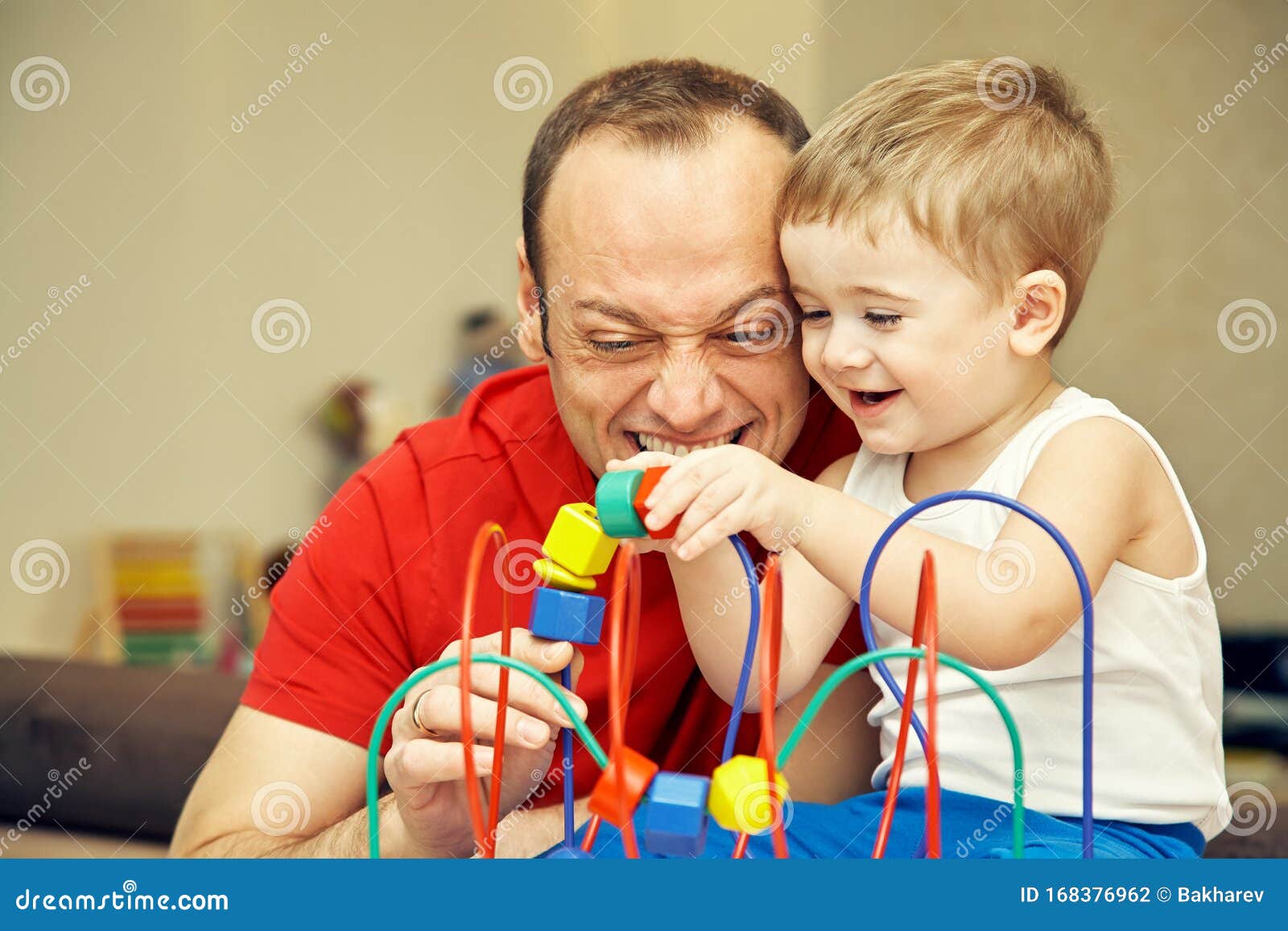 Father Playing with His Child in Developing Game at Home. Dad and Son ...