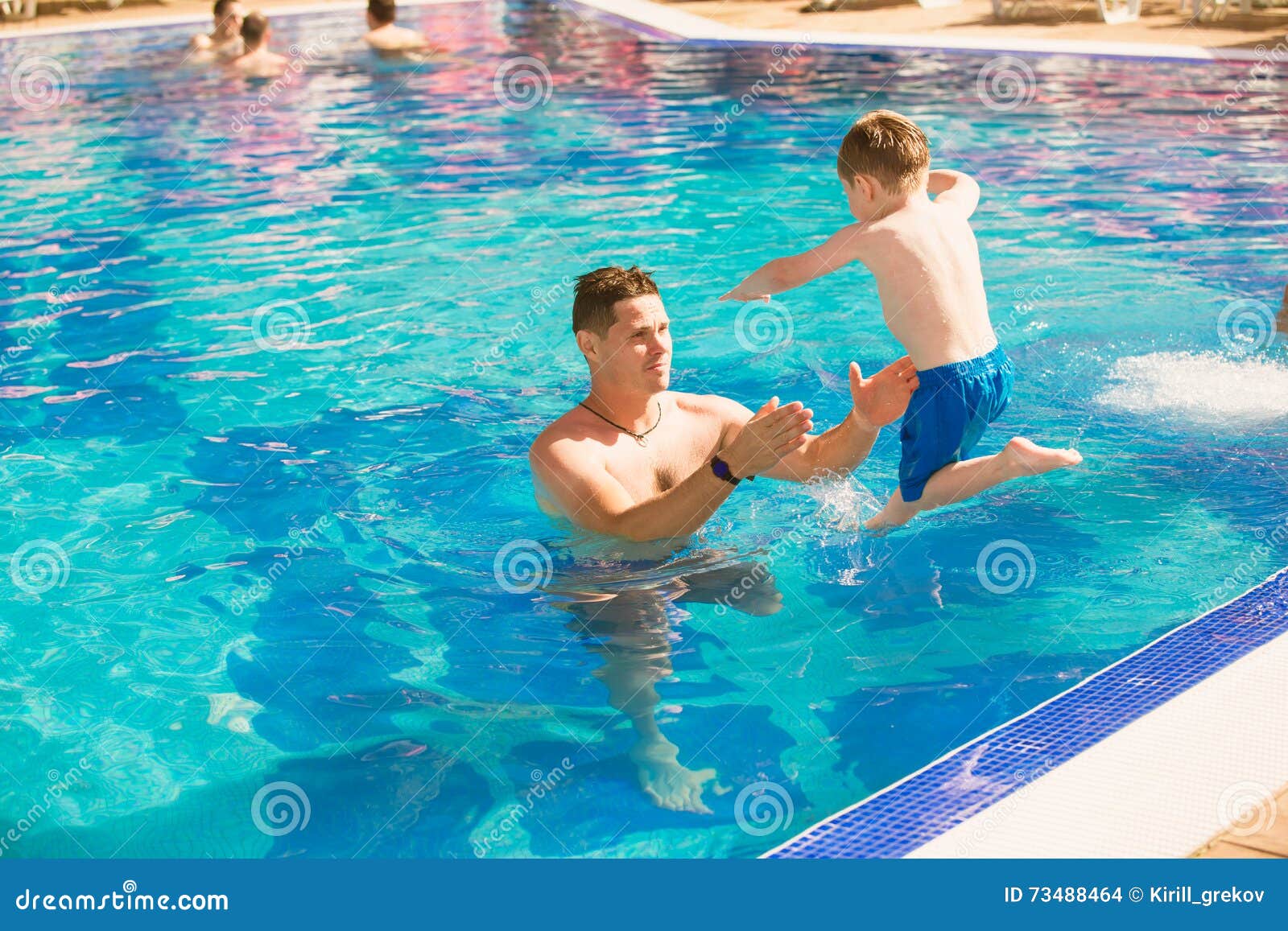 Father Playing with Son in Pool Stock Photo - Image of silly, family ...