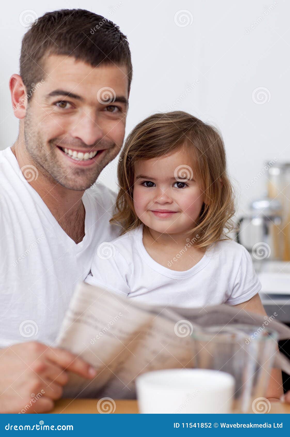 Father Reading a Newspaper with His Daughter Stock Photo - Image of ...
