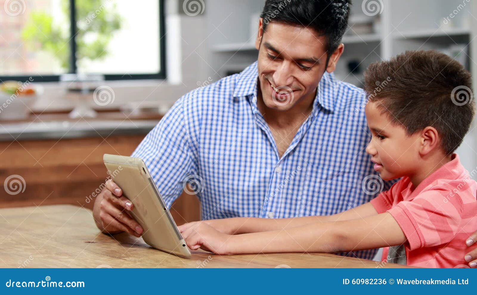 Father Showing His Son How To Use a Tablet Stock Footage - Video of ...