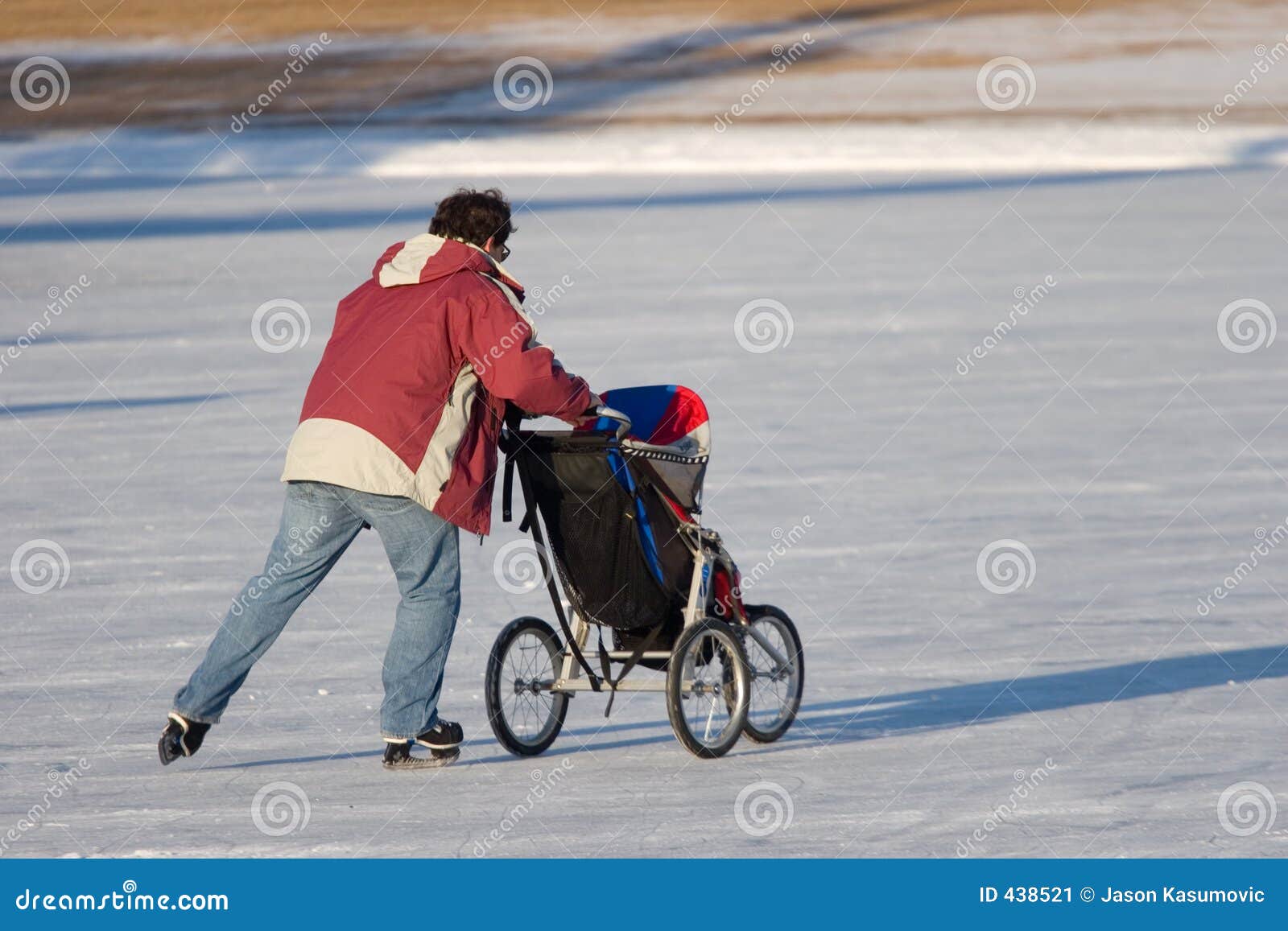 Father Skating with Baby stock image. Image of stroller - 438521