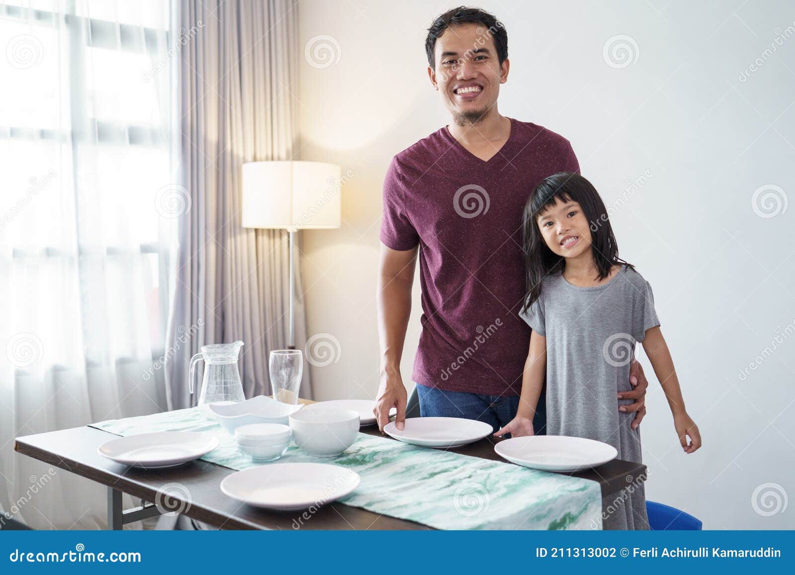 Father and Small Daughter Preparing Dining Table for Dinner Stock Photo ...