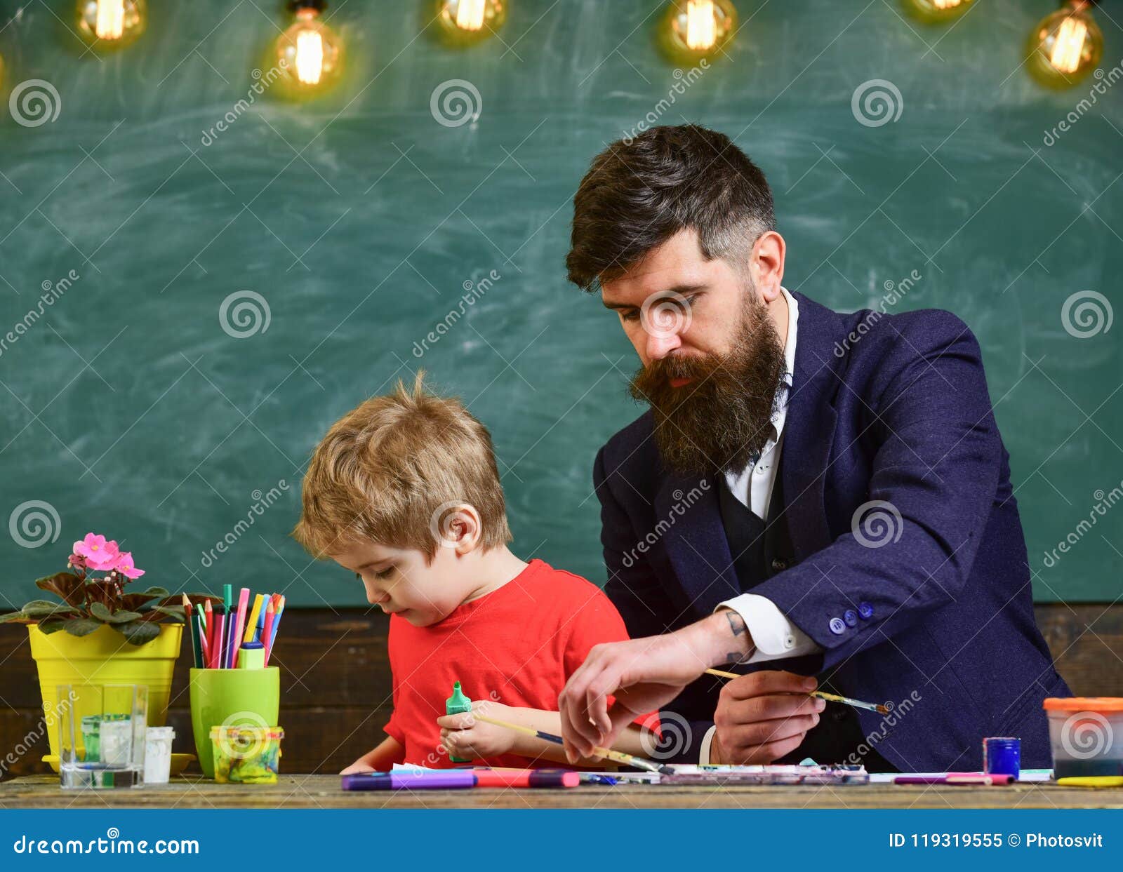 Father and Son at the Art Class. Daddy Holding Brushes for His Boy ...
