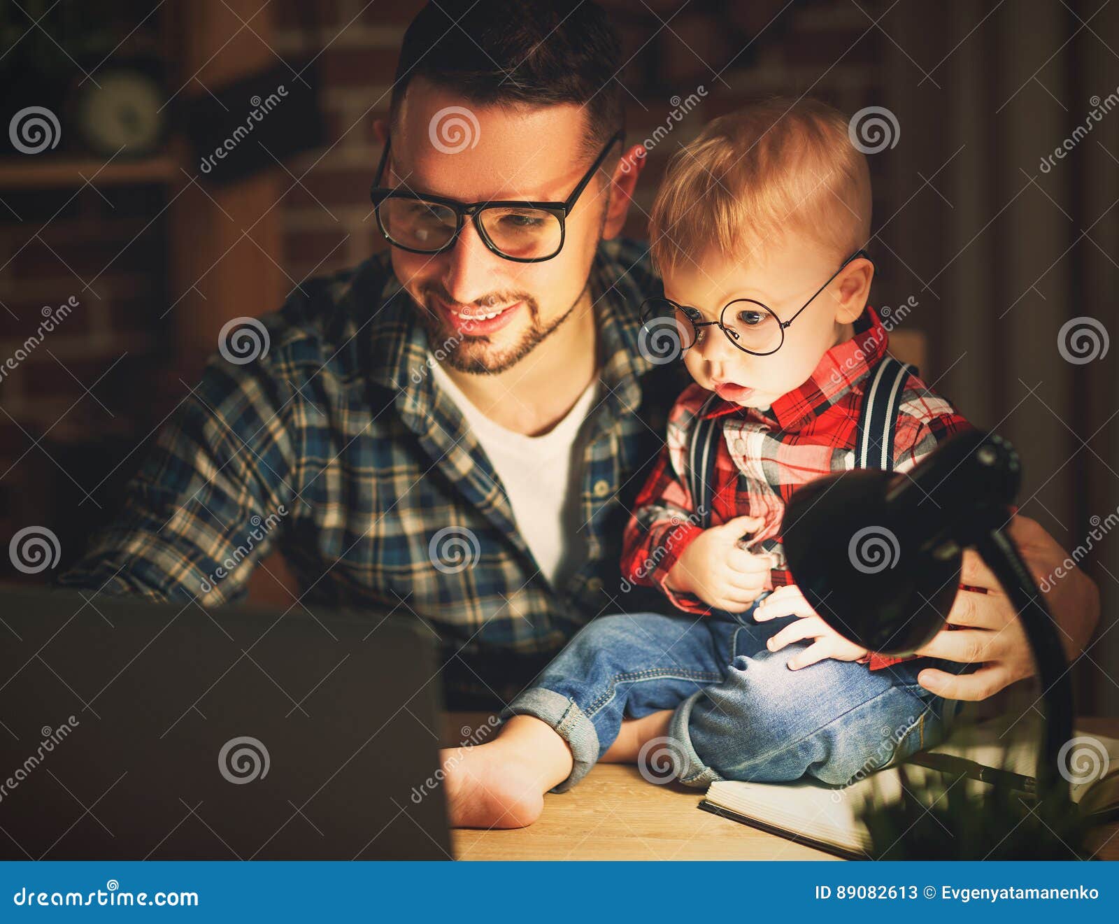 Father and Son Baby Work at Home at Computer in Dark Stock Image ...