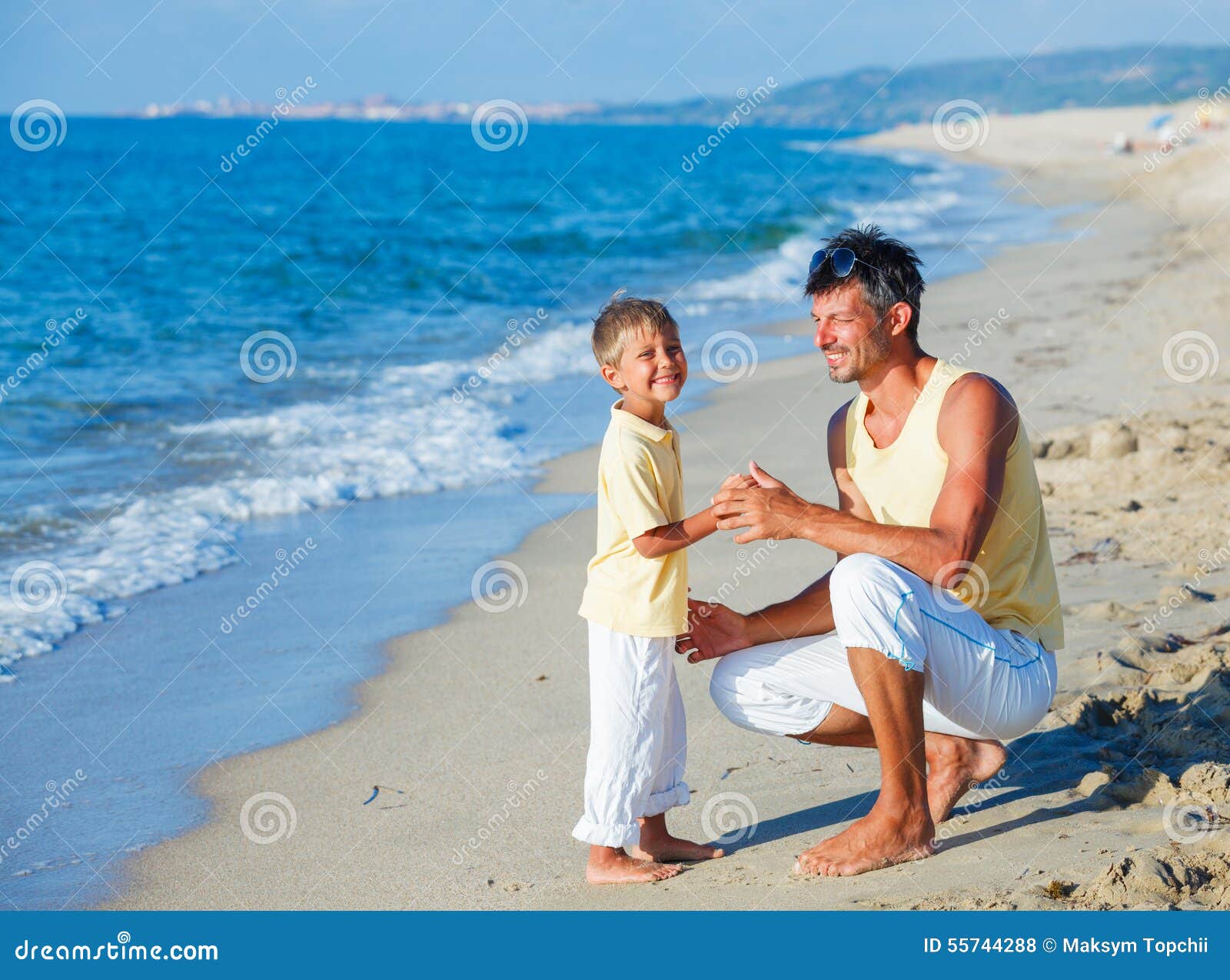 Father and son on beach stock photo. Image of father - 55744288