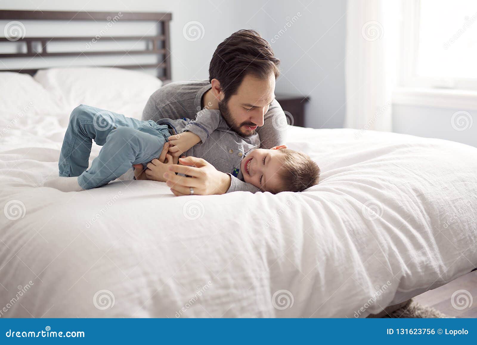 Father and Son in Bed, Happy Time on Bed Stock Photo - Image of ...