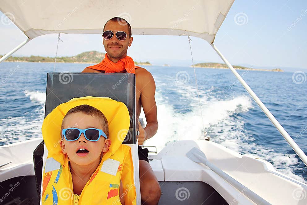 Father and son on boat stock image. Image of boating - 80185495