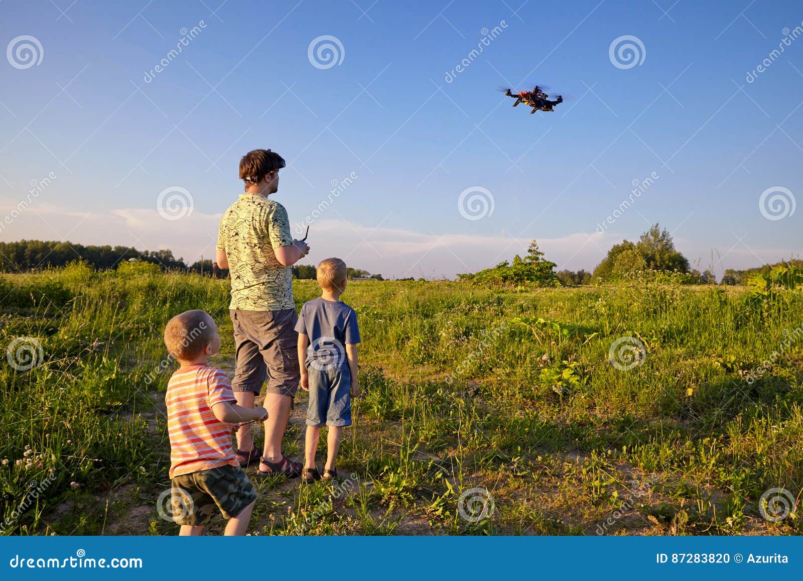 Father and Son Controls RC Drone in the Sky Stock Photo - Image of ...