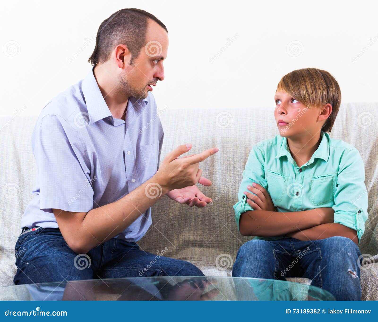 Father and Son Discussing Serious Stock Photo - Image of interior ...