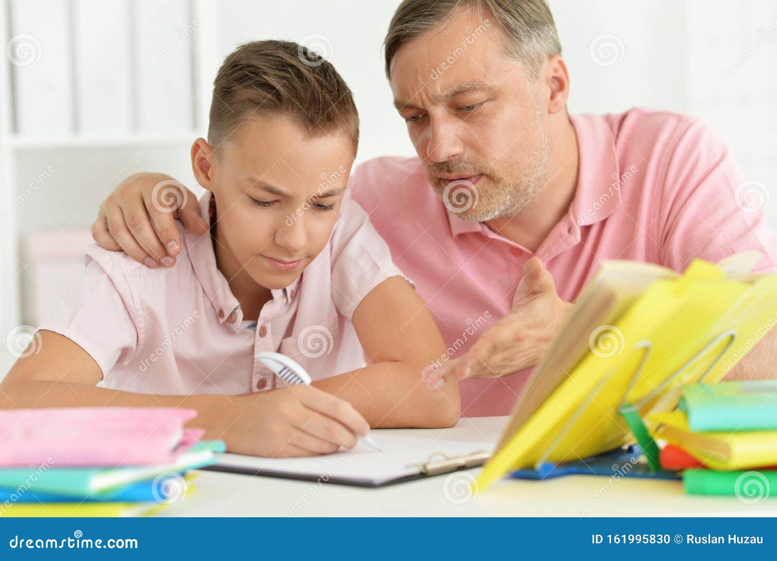 Portrait of Father and Son Doing Homework Stock Photo - Image of ...