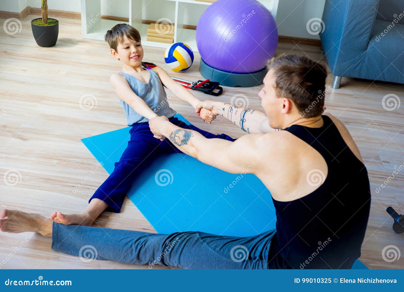 Father and Son Doing Sit Ups Stock Image - Image of together, smile ...