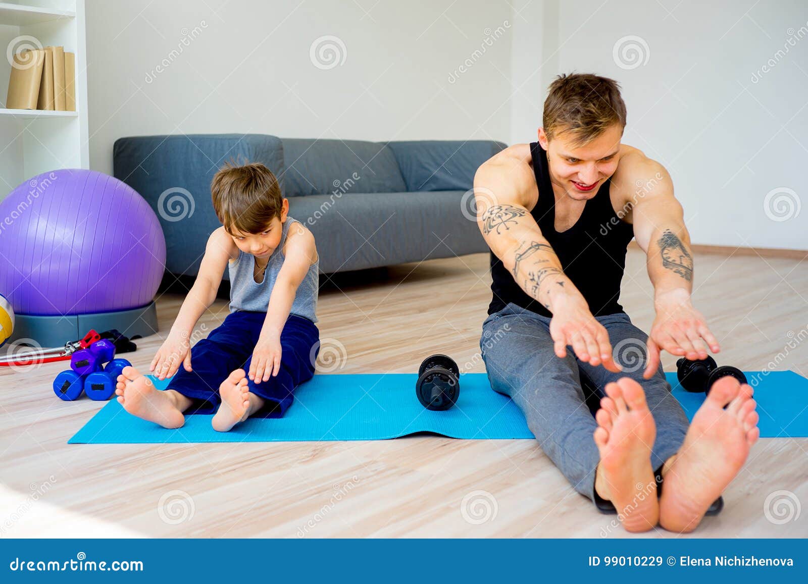 Father and Son Doing Sit Ups Stock Image - Image of girl, healthy: 99010229