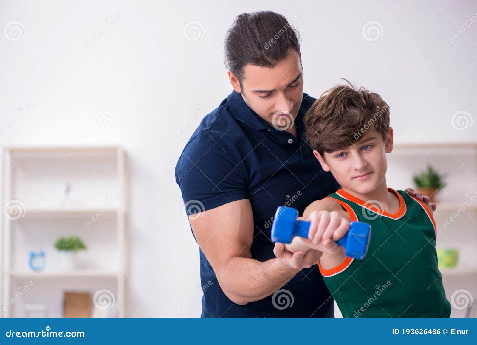 Father and Son Doing Sport Exercises Indoors Stock Photo - Image of ...