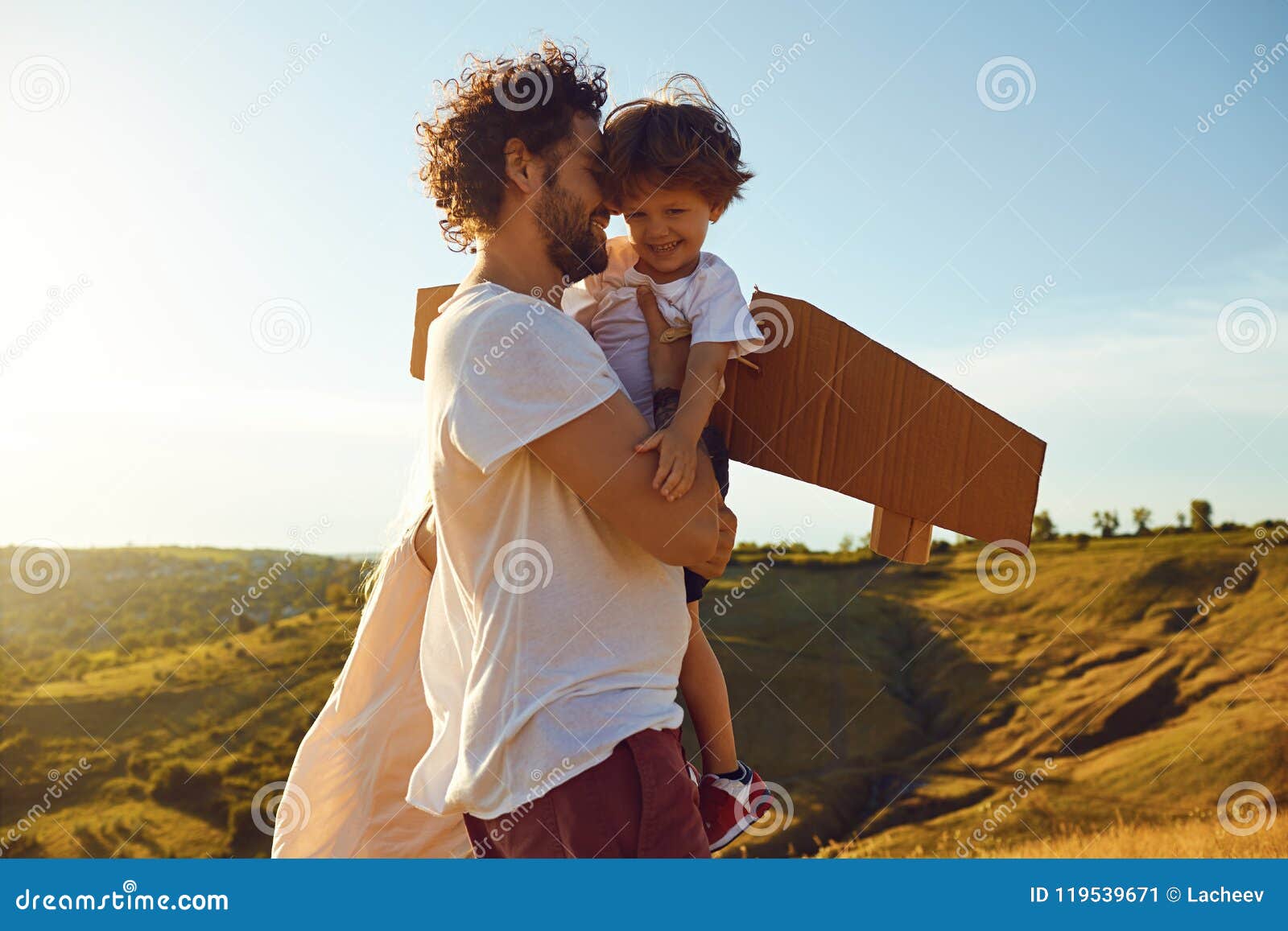 Father and Son Embrace in Nature at Sunset Stock Image - Image of ...