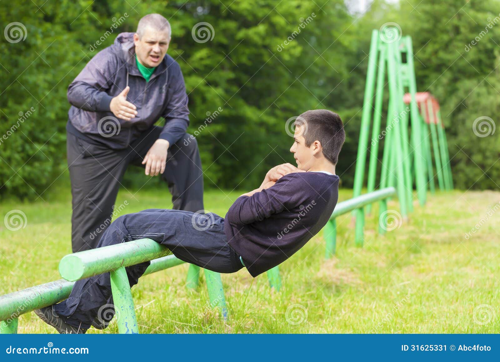 Father and Son Engaged in Athletic Exercises Stock Image - Image of ...