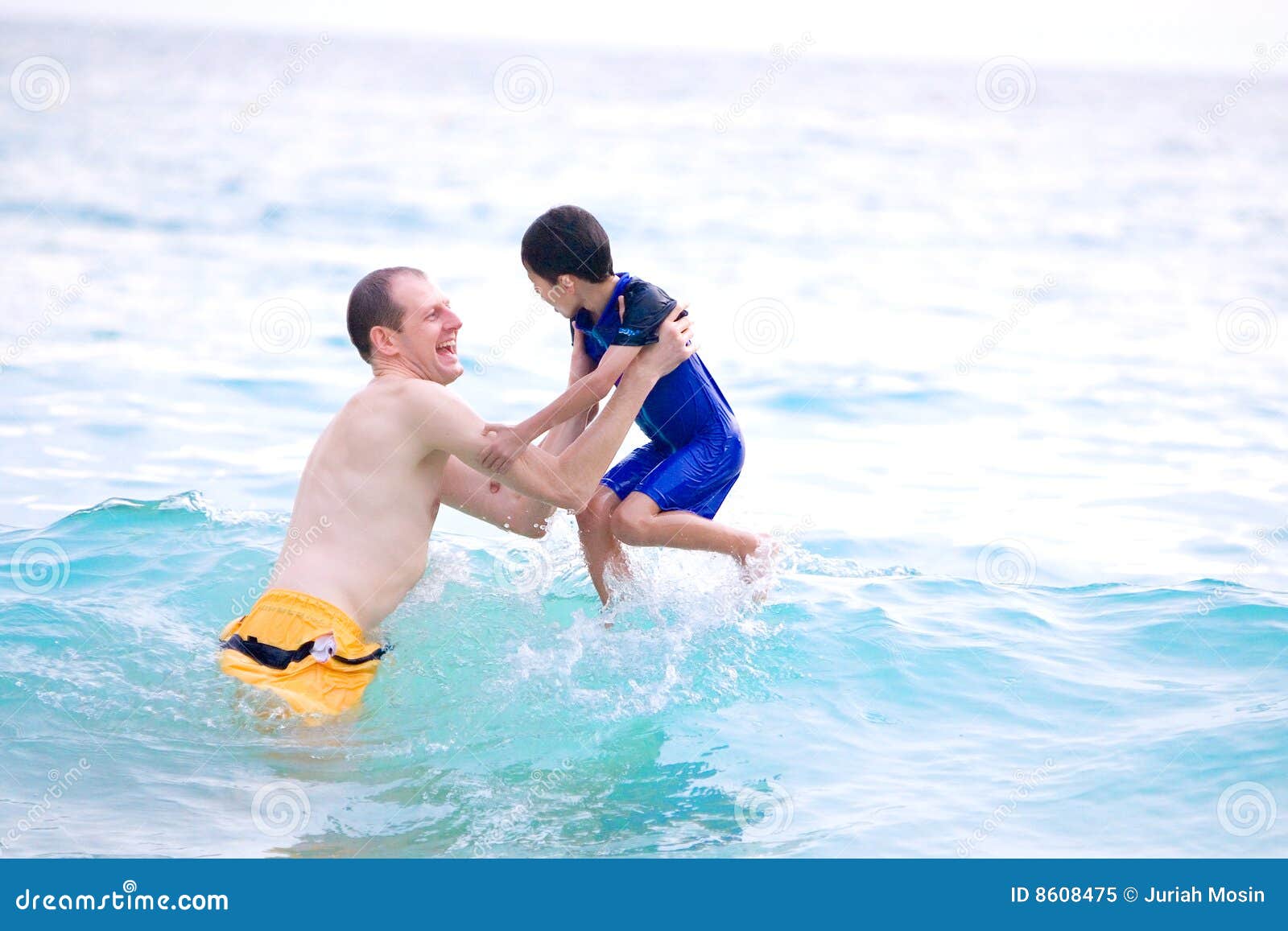 Father and Son Enjoying the Waves Stock Image - Image of excitement ...