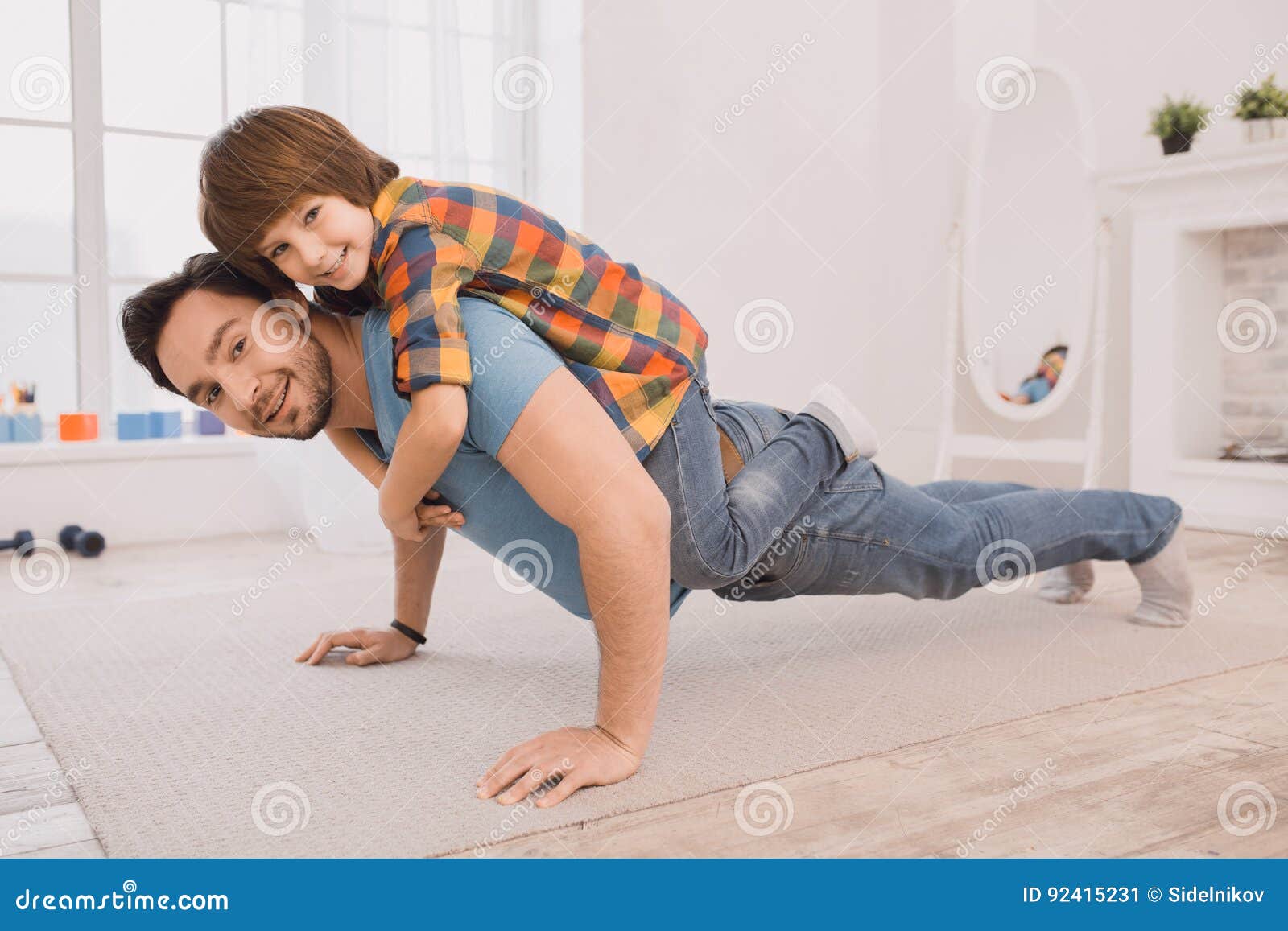 Father and Son Exercise Together at Home Stock Image - Image of ...