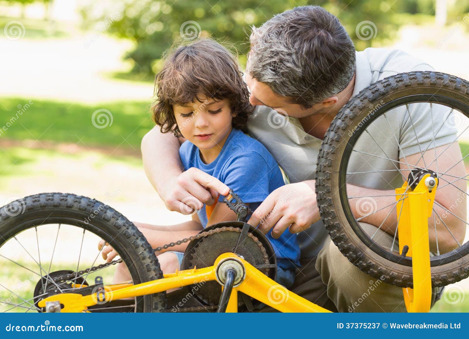 Father and son fixing bike stock image. Image of parent - 37375237