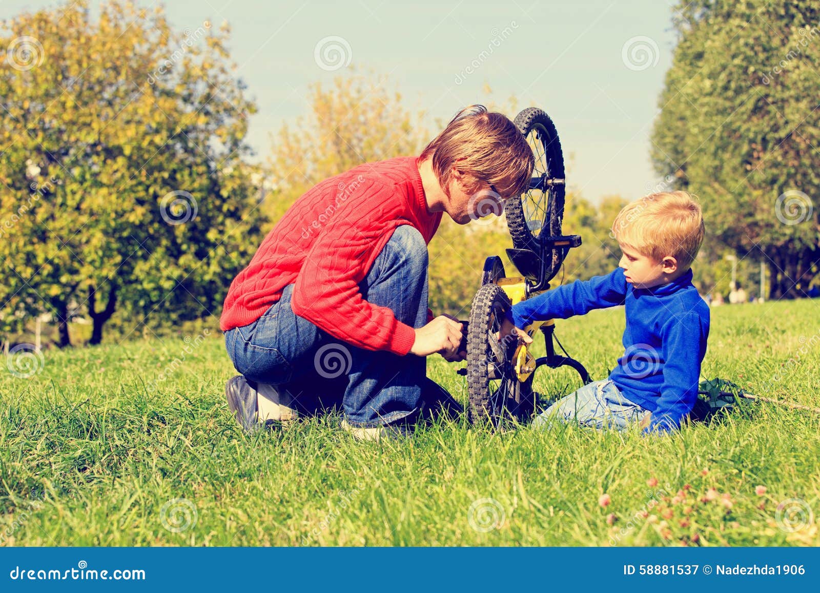Father and Son Fixing Bike Outdoors Stock Image - Image of cycle ...