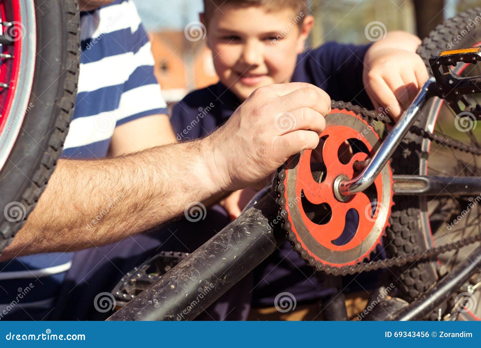 Father and son fixing bike stock photo. Image of happy - 69343456