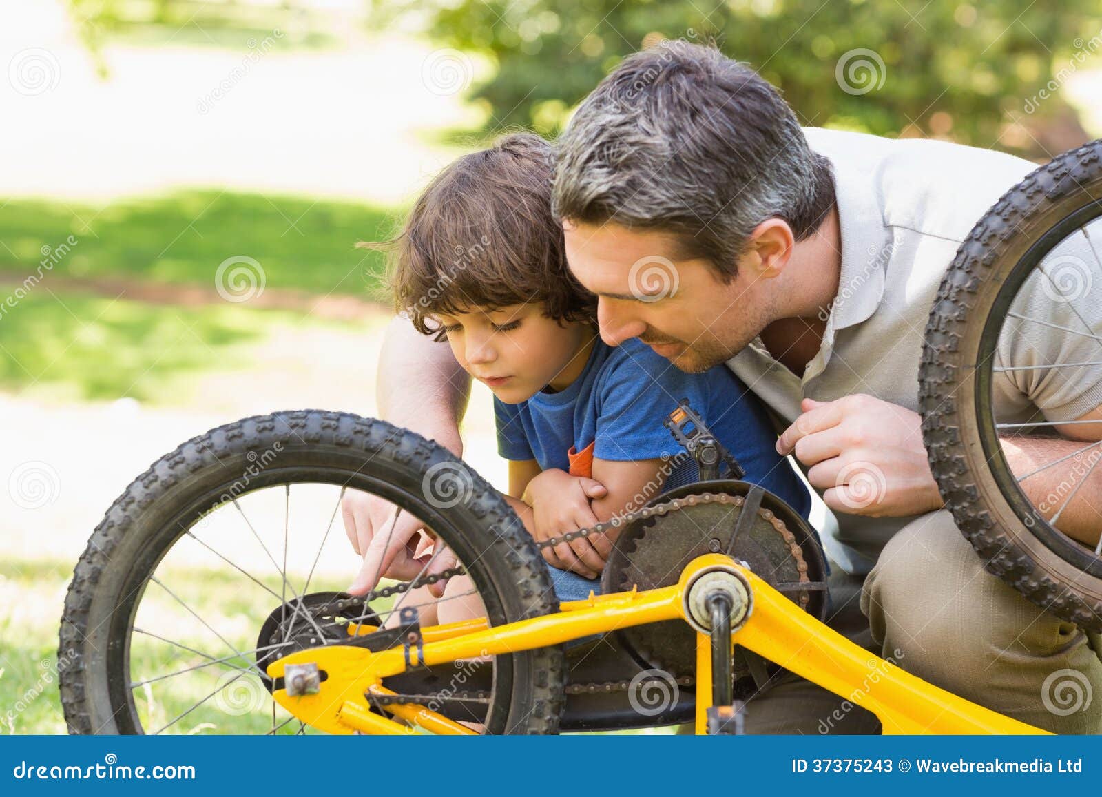 Father and son fixing bike stock image. Image of side - 37375243