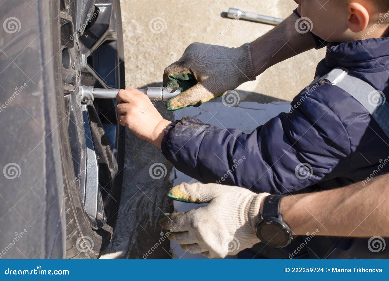Father and Son are Fixing the Car. the Son Helps the Dad. Happy Father ...