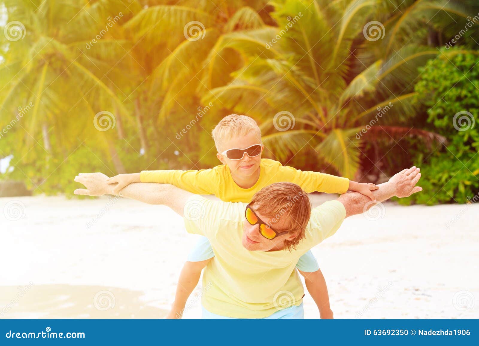 Father and Son Flying at the Beach Stock Photo - Image of cheerful ...