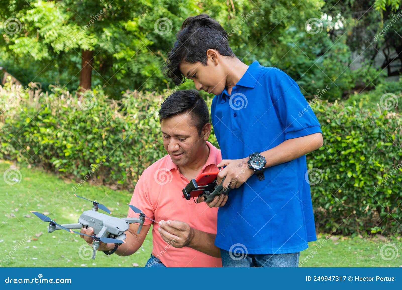 Father and Son Flying Drone Over Field during Summer Stock Image ...