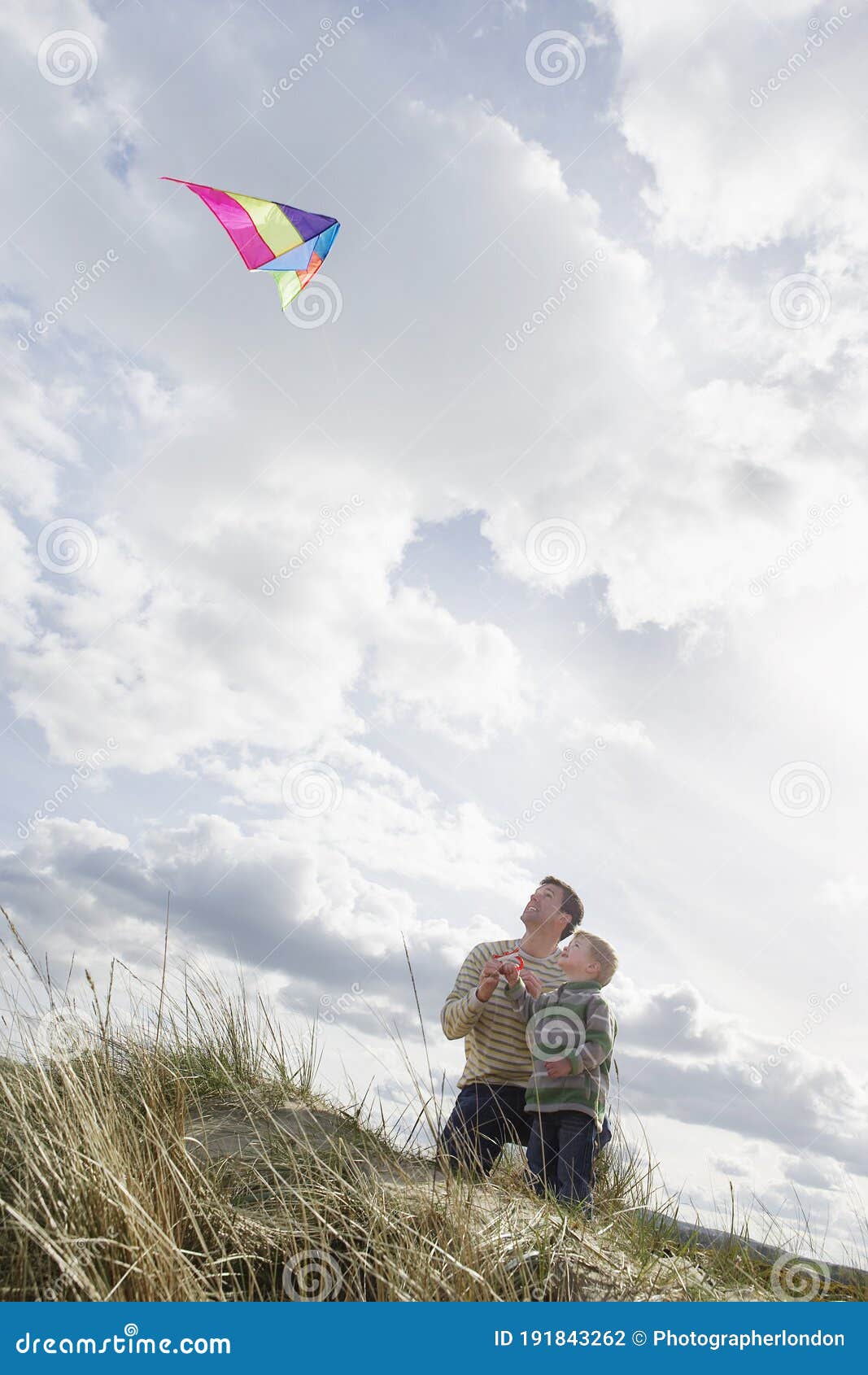 Father and Son (5-6) Flying Kite on Dunes Stock Photo - Image of arabia ...