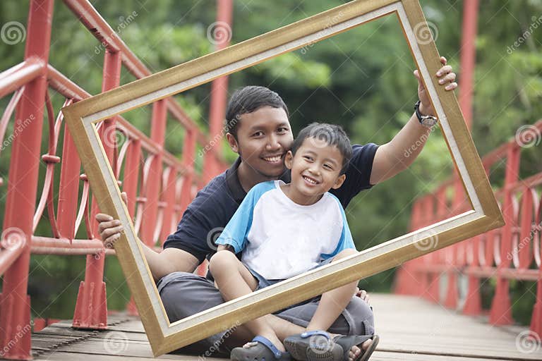 Father and Son with a Frame Stock Photo - Image of child, holiday: 22837318