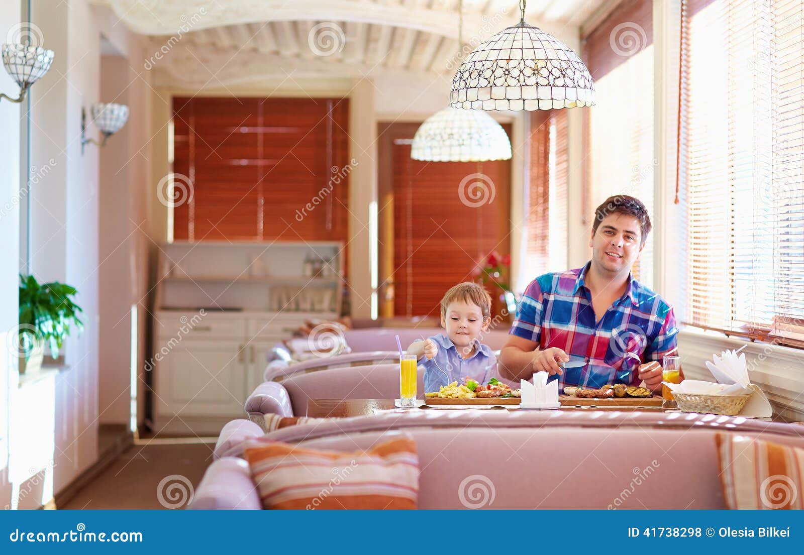 Father and Son Have a Dinner in Restaurant Stock Photo - Image of life ...