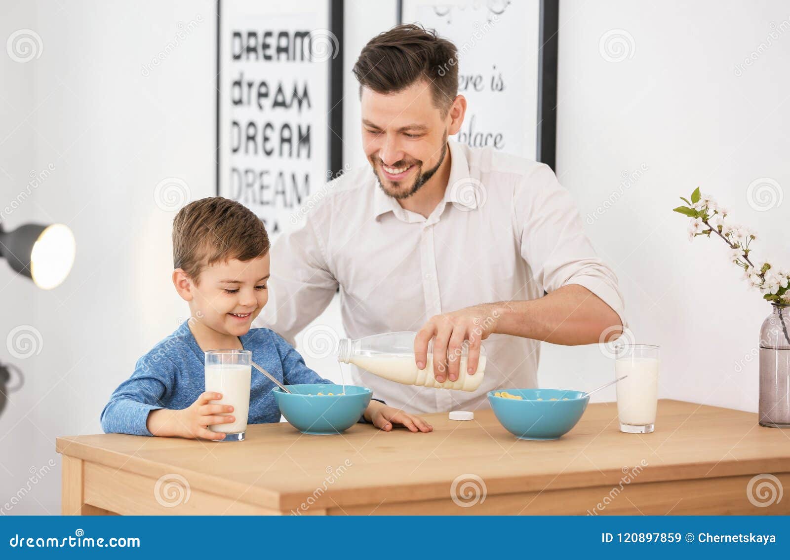 Father and Son Having Breakfast with Milk Stock Image - Image of ...