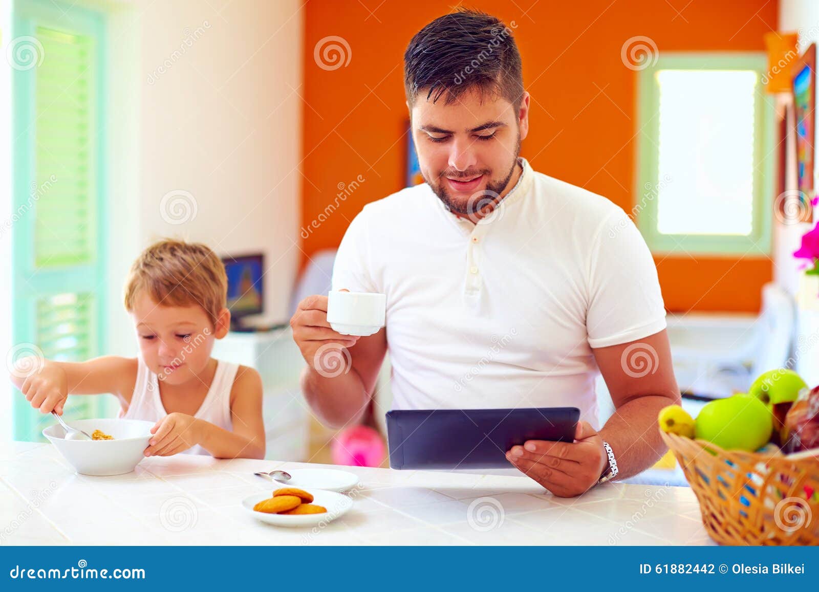 Father and Son Having Breakfast in the Morning at Home Kitchen Stock ...