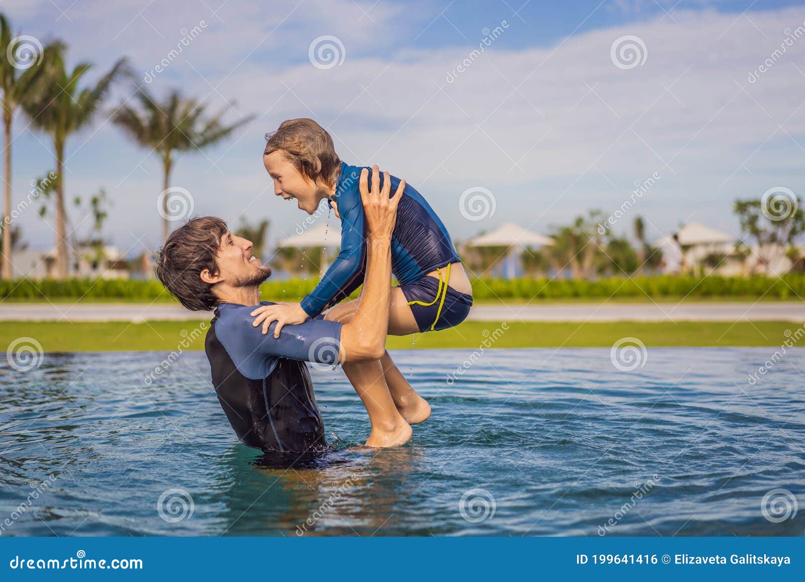 Father and Son Having Fun in the Swimming Pool Stock Photo - Image of ...