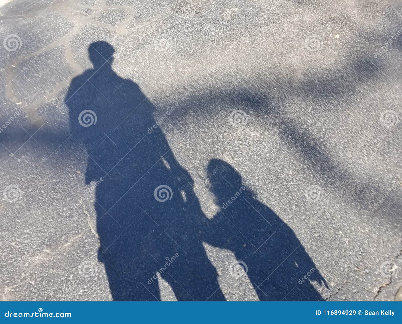 Shadows of Father and Son stock image. Image of father - 116894929