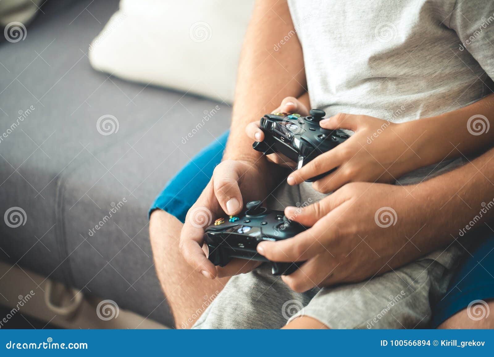 Father With Son With Joystick Controllers In Hands Stock Photo ...