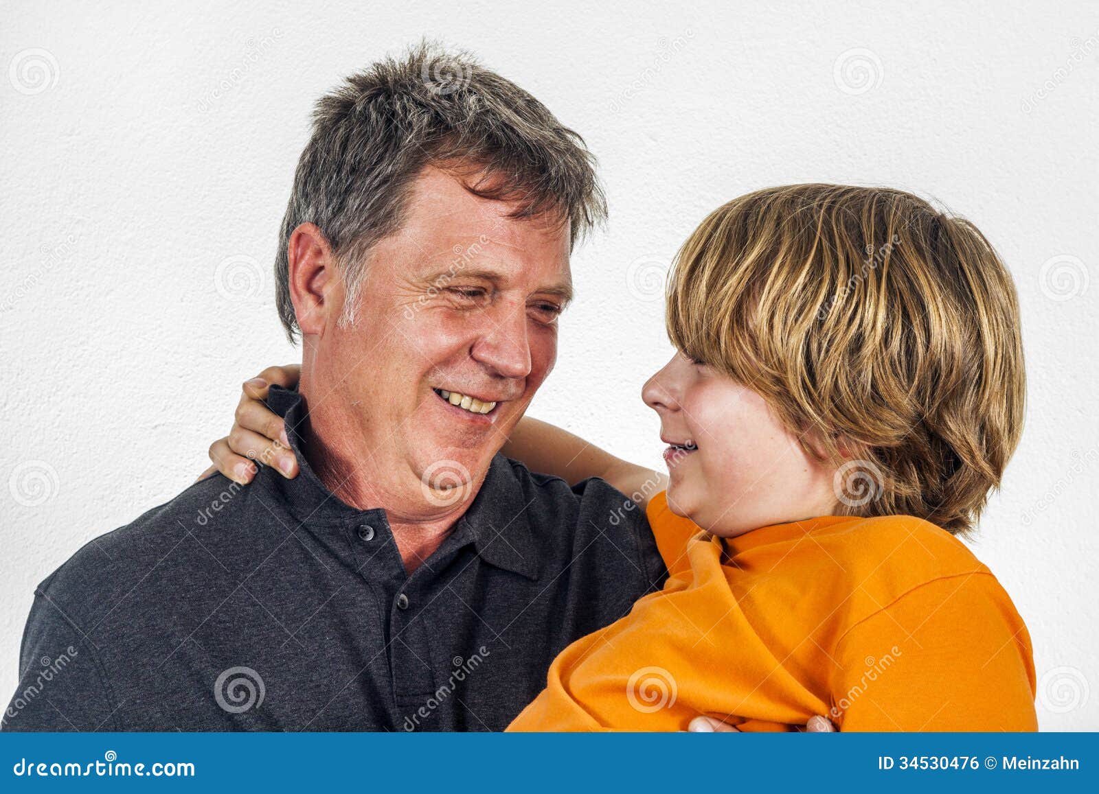 Father and son hugging stock photo. Image of feeling - 34530476