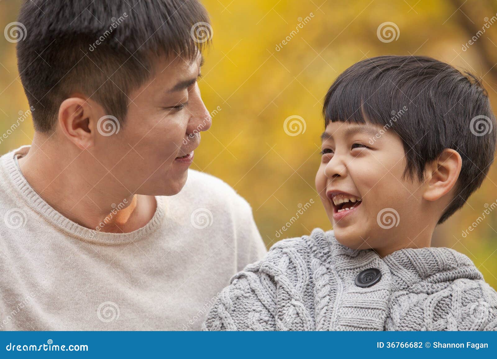 Father and Son Laughing in the Park in Autumn, Close-up Stock Photo ...
