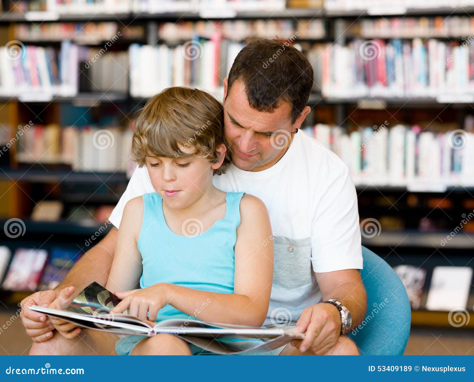 Father with son in library stock image. Image of portrait - 53409189