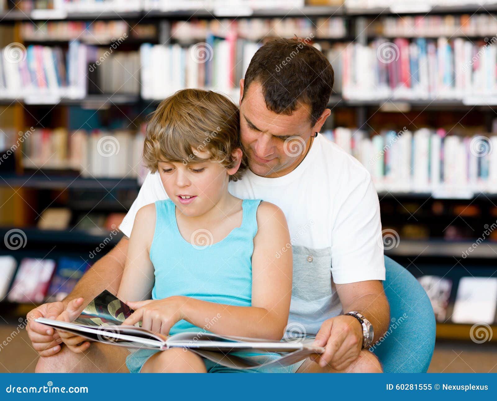 Father with son in library stock image. Image of learn - 60281555