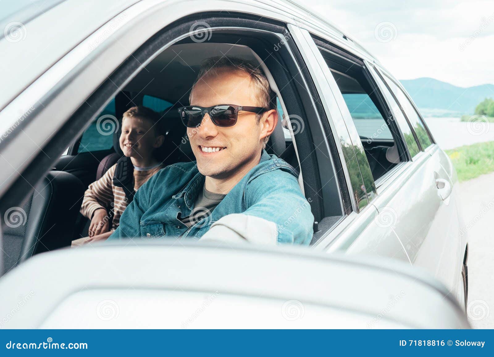 Father and Son Look Out from Car Window Stock Photo - Image of front ...
