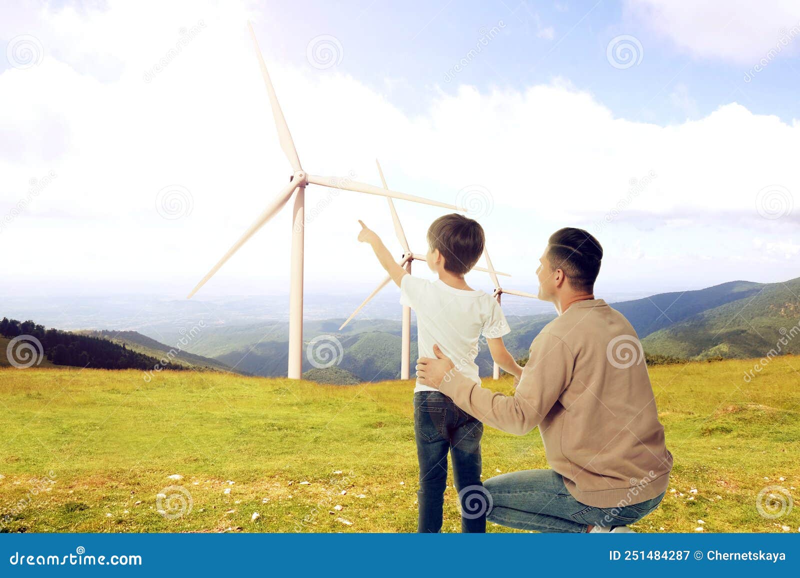 Father with Son Looking at Wind Energy Turbines Stock Image - Image of ...